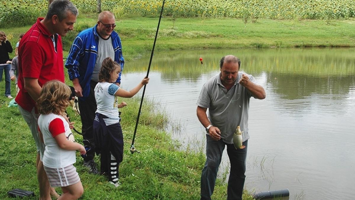 Family day fishing in a private pond